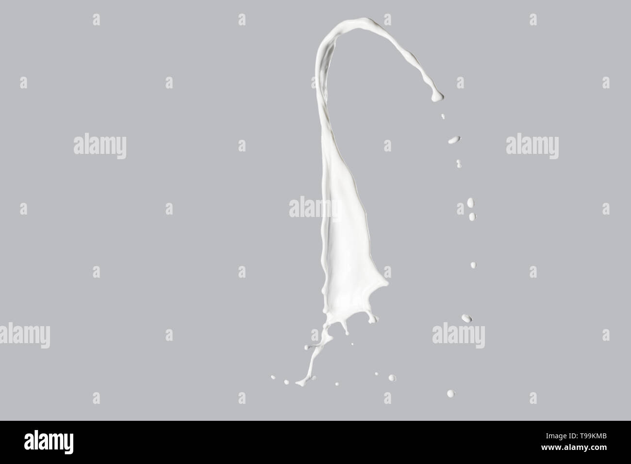 Splash of milk on grey background Stock Photo - Alamy