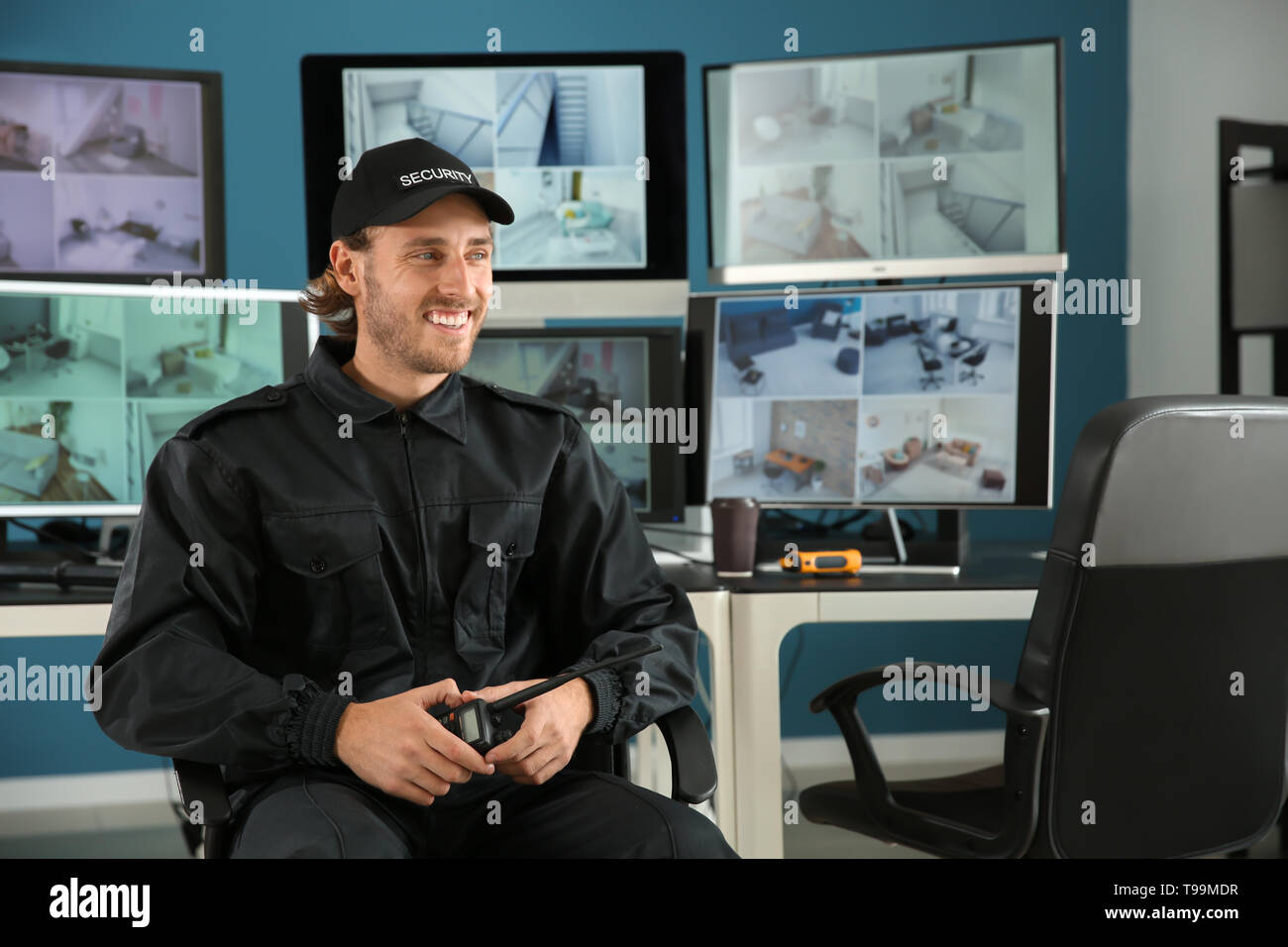 Security guard in surveillance room Stock Photo - Alamy