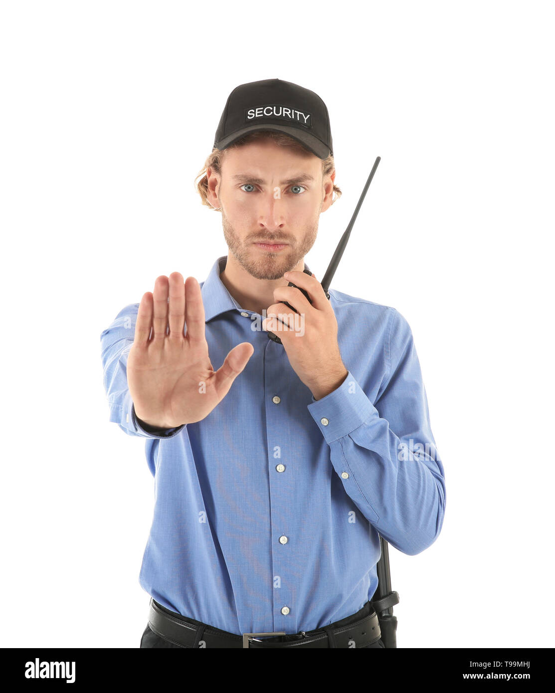 Male security guard with portable radio transmitter showing Stop ...