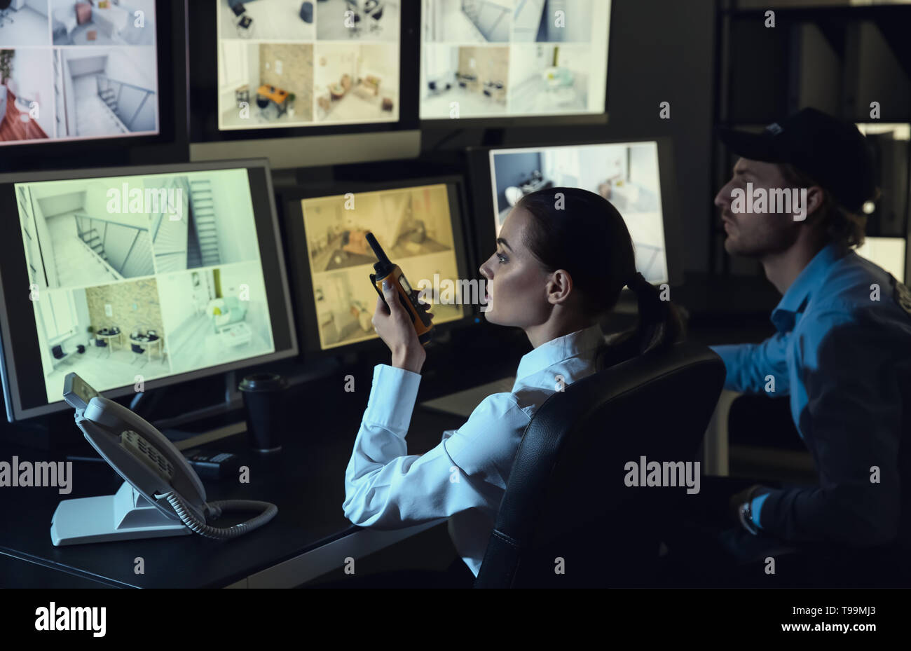 Male female security guards cctv hi-res stock photography and images ...