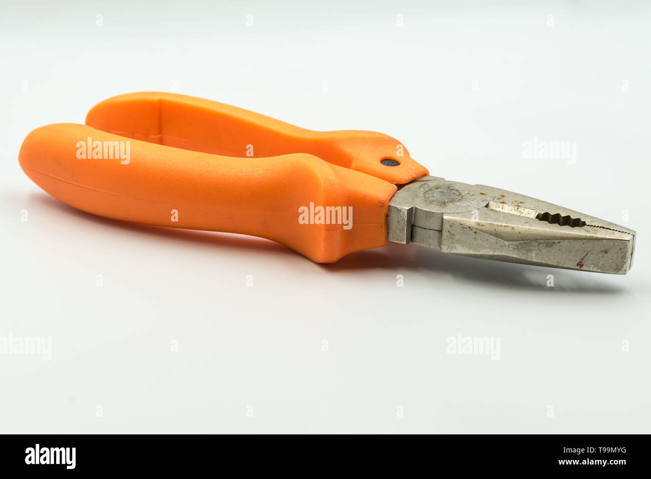 This is a capture of an orange diagonal pliers with a white background ...