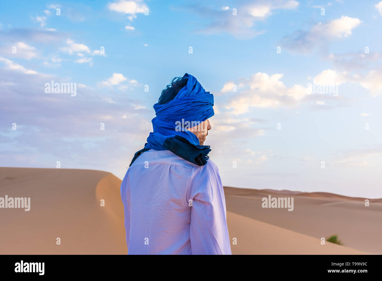 Berber man wearing traditional tuareg clothes in the Sahara Desert at ...
