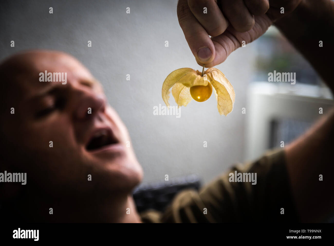 Man eating mouth open hi-res stock photography and images - Alamy