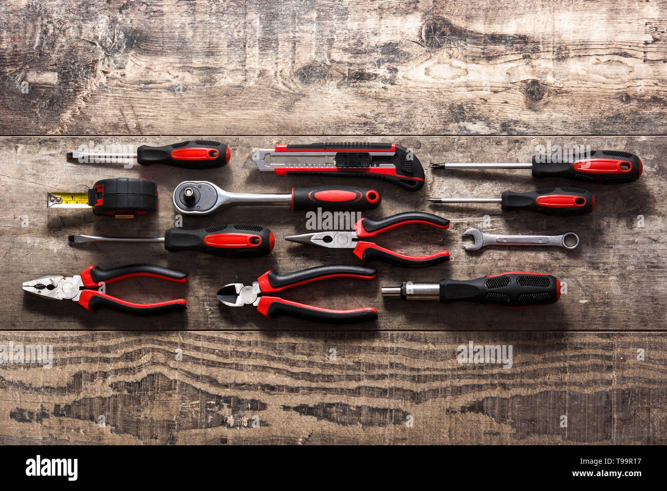 Building tools repair set on wooden table. Top view Stock Photo - Alamy