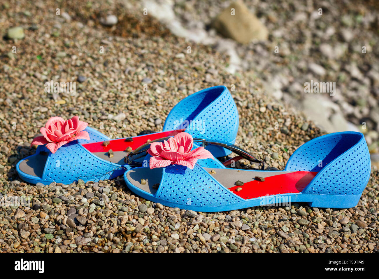 blue sandals on the beach by the sea, summer vacation concept Stock ...