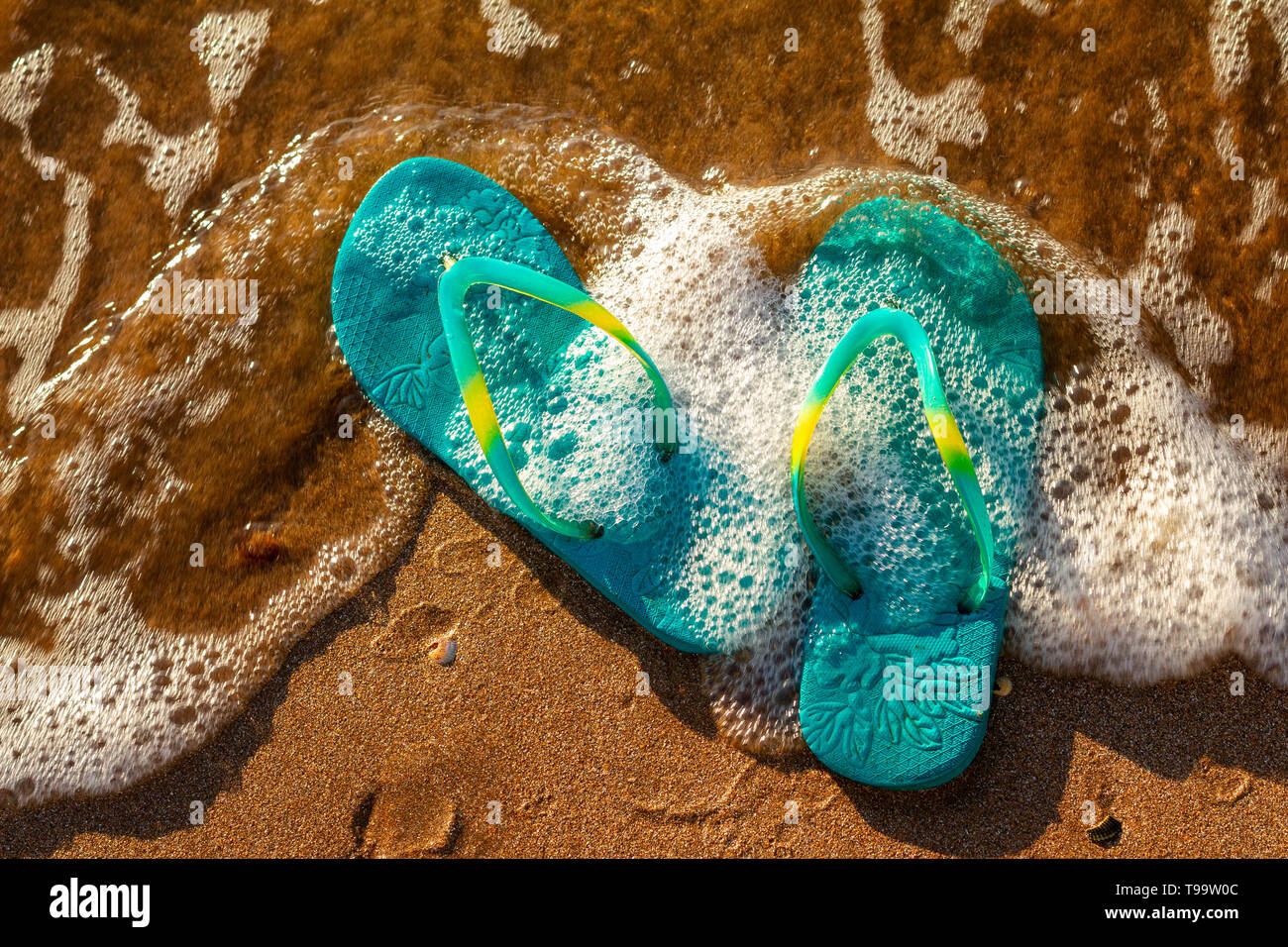 blue sandals on the beach , the concept of rest on the sea Stock Photo ...