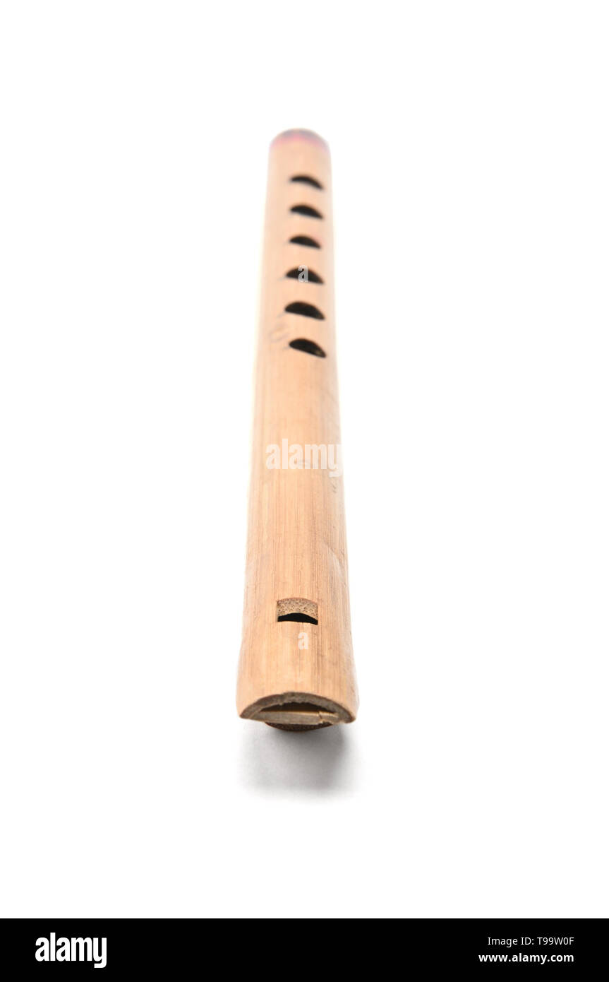 Wind musical instrument flute on an isolated white background.Pide ...
