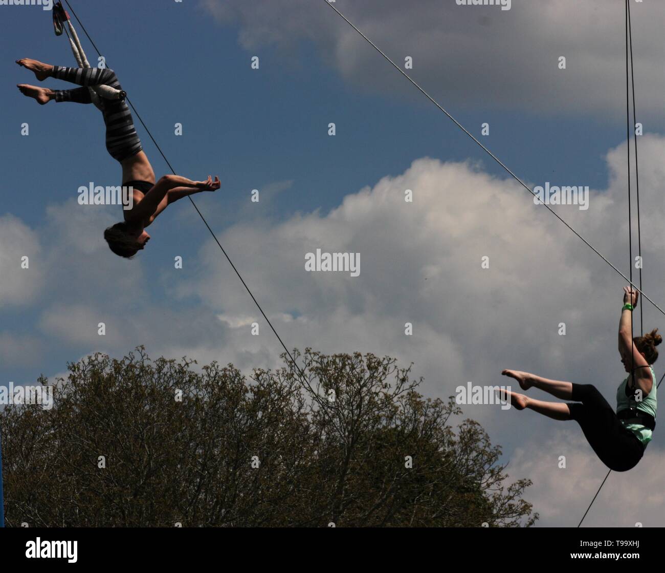 Trapeze catching hi-res stock photography and images - Alamy