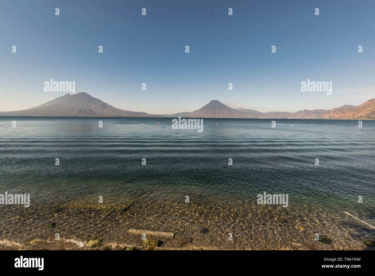 Lake Atitlan, with mountains and volcanoes, in Guatemala Stock Photo ...