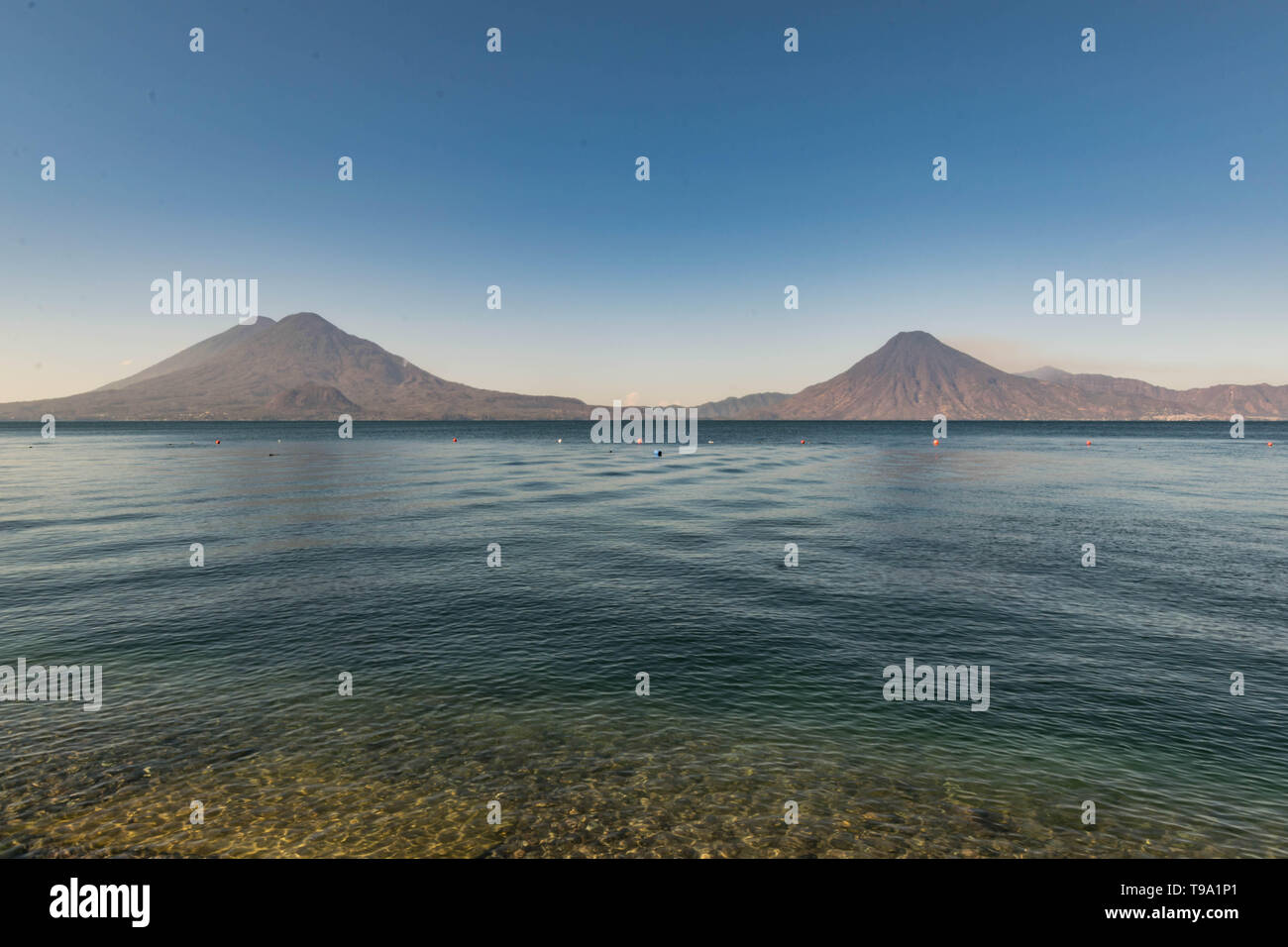 Lake Atitlan, with mountains and volcanoes, in Guatemala Stock Photo ...
