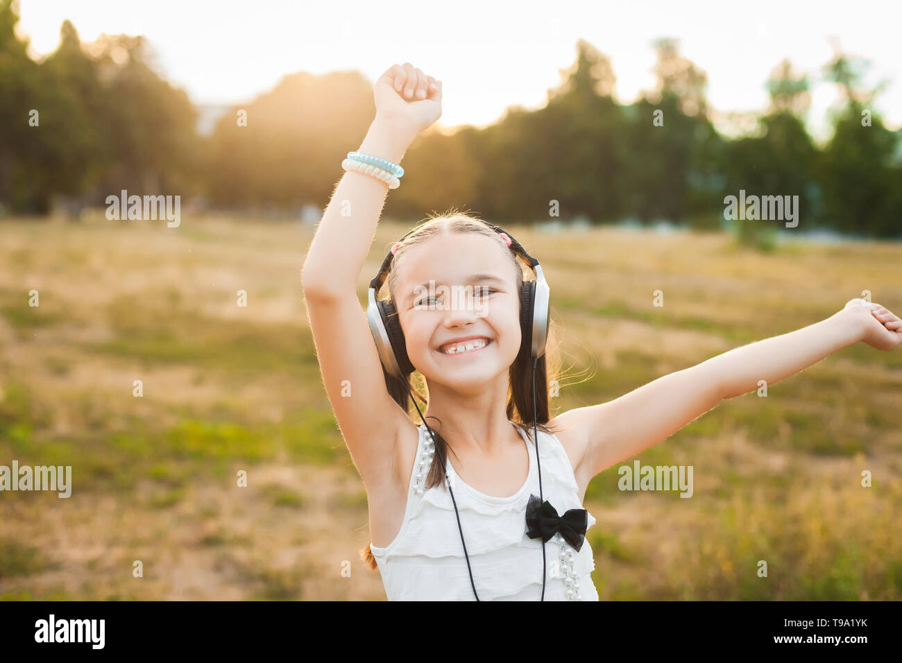 happy girl listening music and dancing Stock Photo - Alamy
