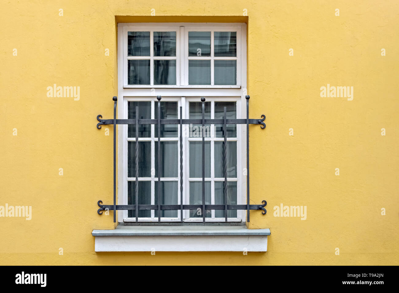 Window with a white rectangular frame and binding, located on the ...