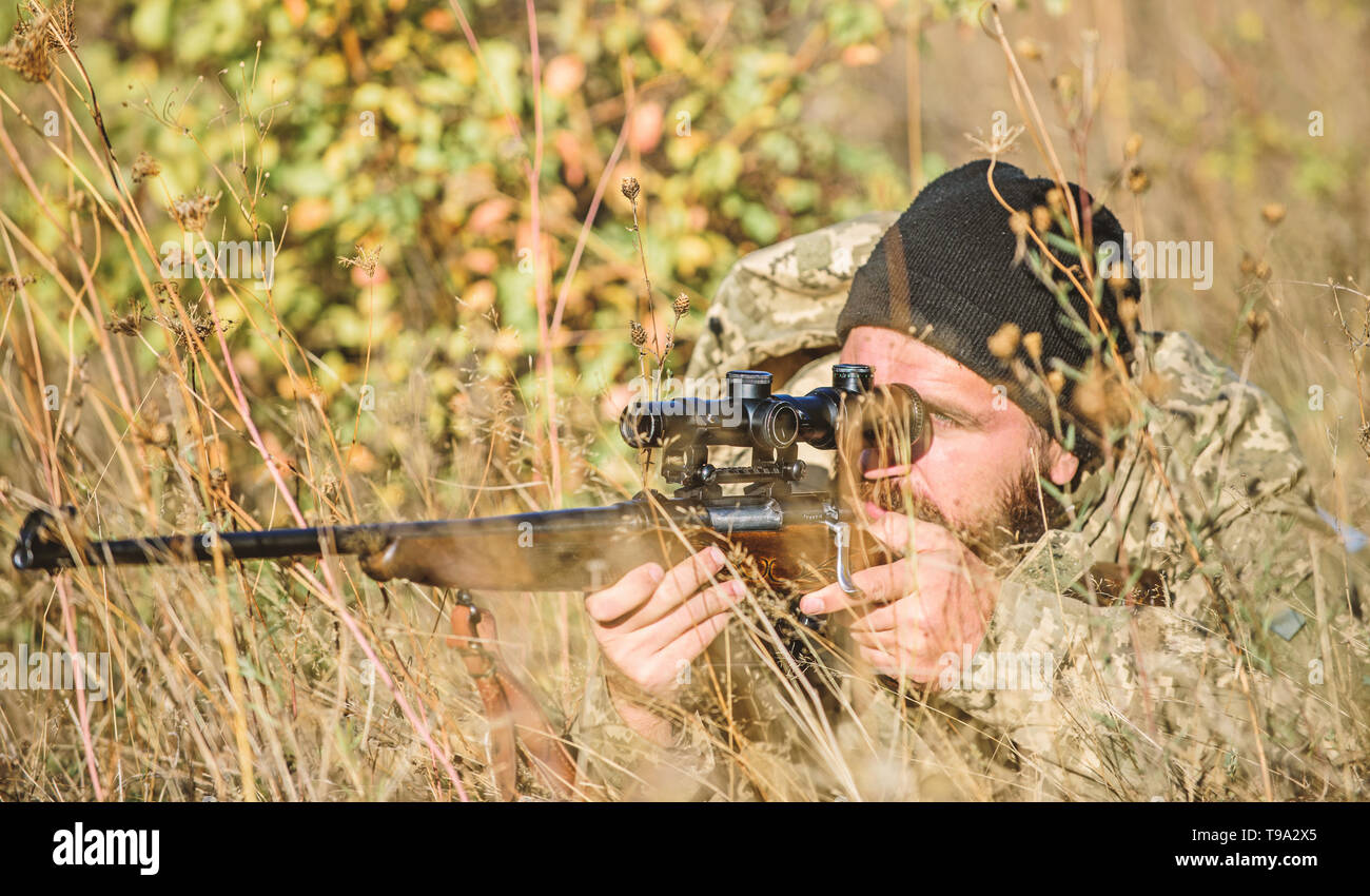 Man hunter with rifle gun. Boot camp. Military uniform fashion. Bearded ...