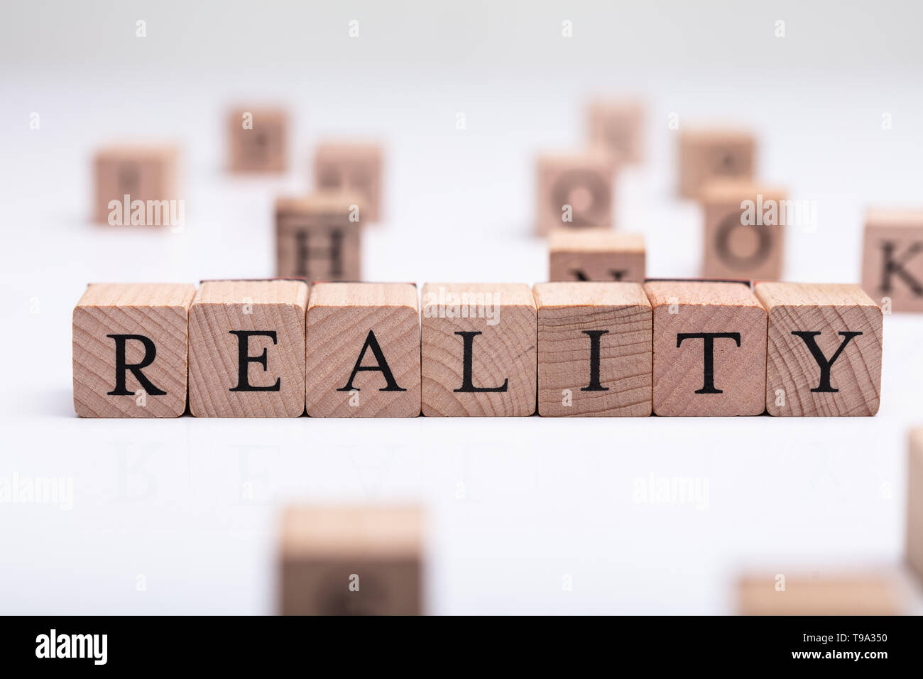 Close-up Of Wooden Blocks With Reality Word Over White Desk Stock Photo ...