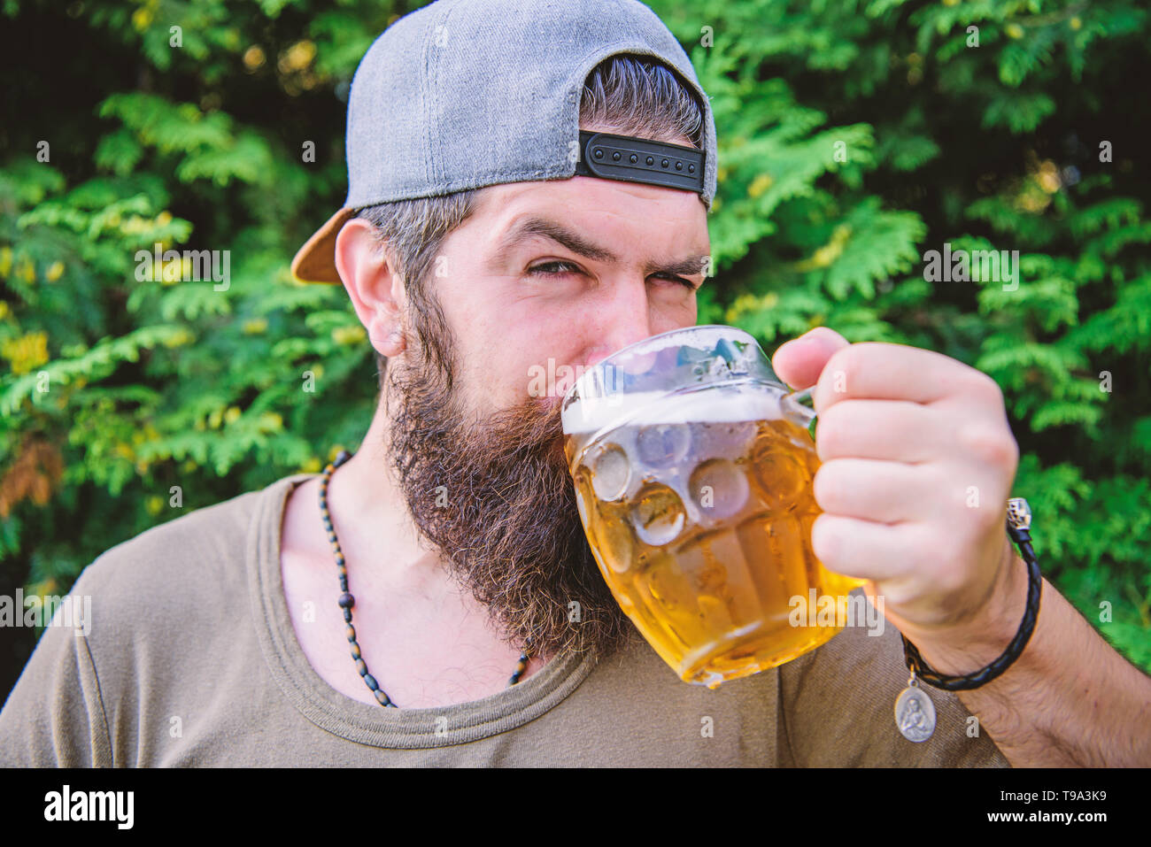 Quench thirst. Man relaxing enjoying beer hot summer day. Hipster ...