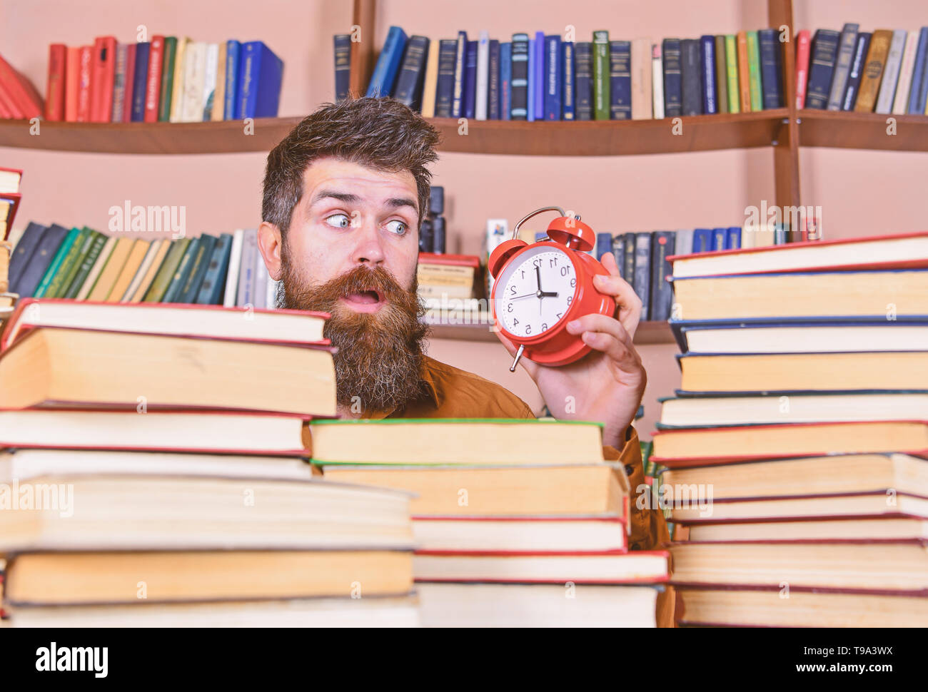 Teacher or student with beard studying in library. Man, scientist ...