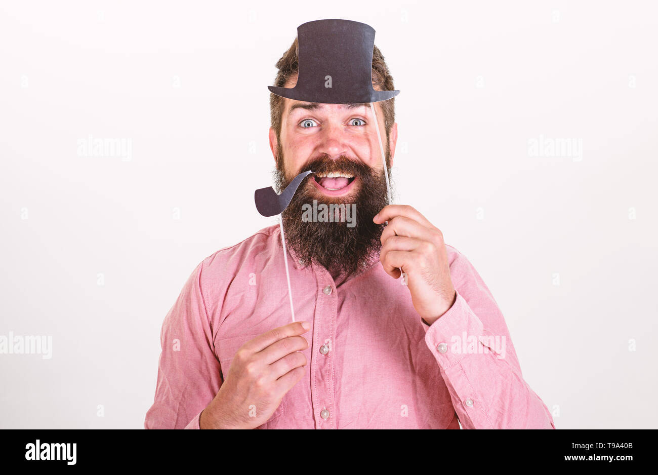 Hipster with beard and mustache on happy face posing with photo booth ...