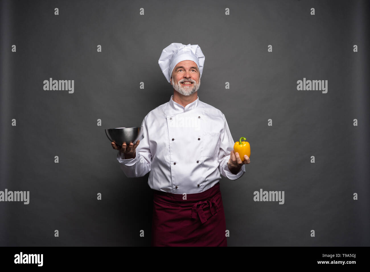 Image of chef planing what to cook on gray background.Chef thinking ...