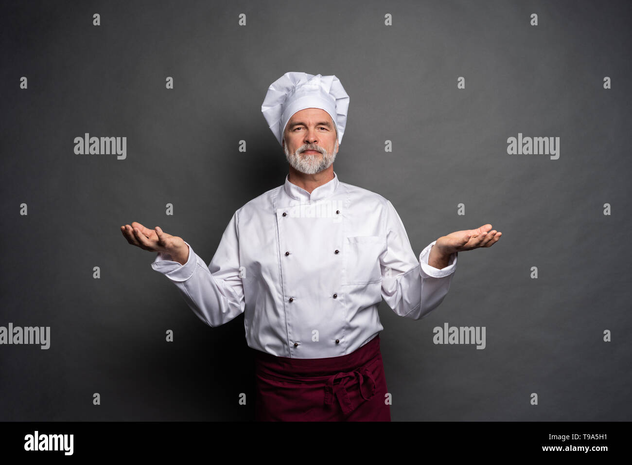 Image of chef planing what to cook on gray background.Chef thinking ...