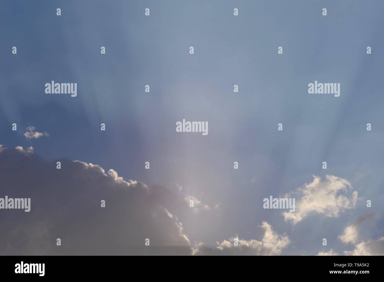 Stunning Crepuscular Sun Rays from Behind Cumulus Mediocris Cloud at ...