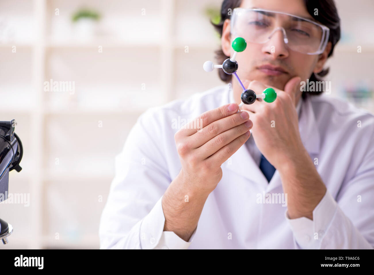Young male scientist working in the lab Stock Photo - Alamy