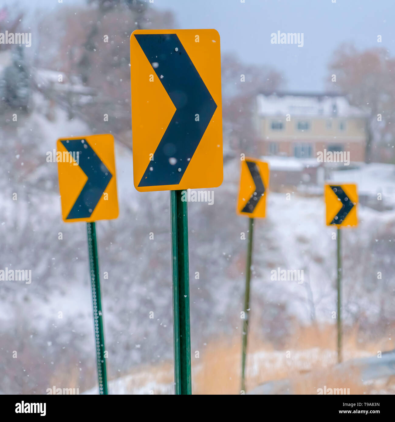 Clear Square Directional road signs against a snowy landscape Stock ...