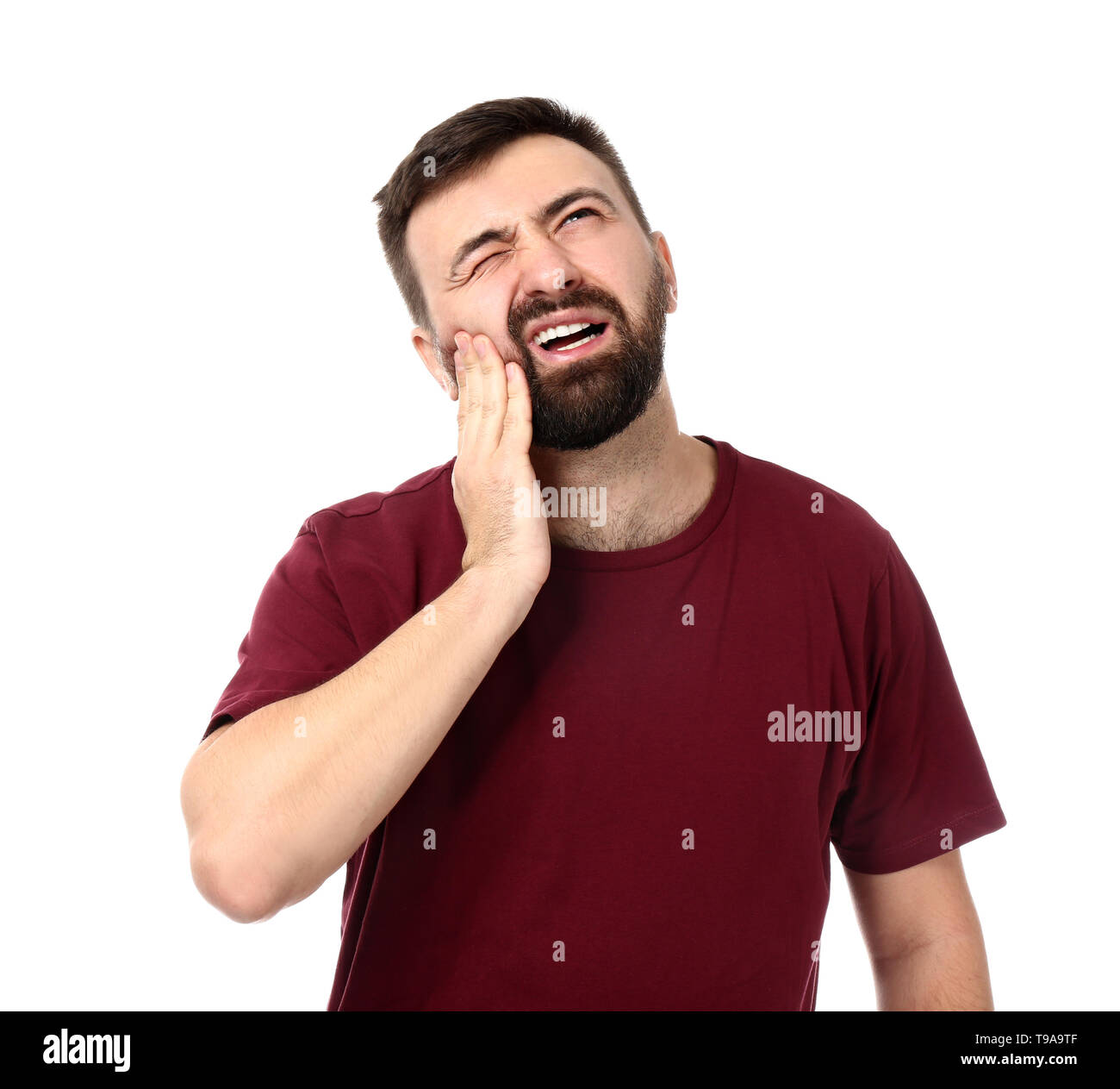 Man suffering from toothache on white background Stock Photo - Alamy