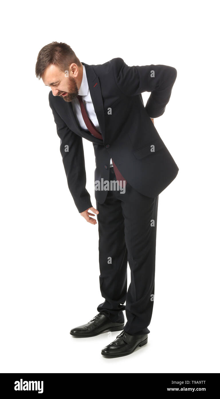 Businessman suffering from back pain on white background Stock Photo ...