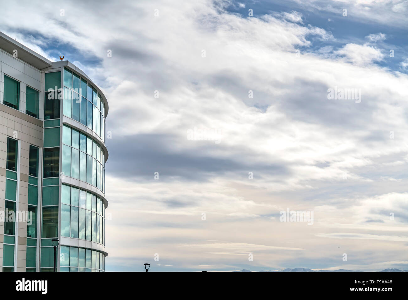 Exterior of a modern building with shiny and reflective glass windows ...