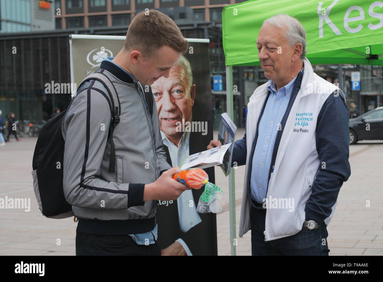 Pekka Puska, European Parliament elections candidate, talks with people ...