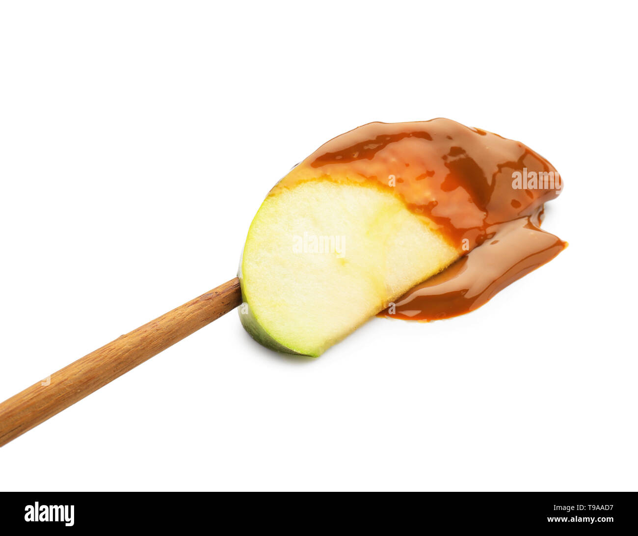 Apple wedge with sweet sauce on white background Stock Photo - Alamy