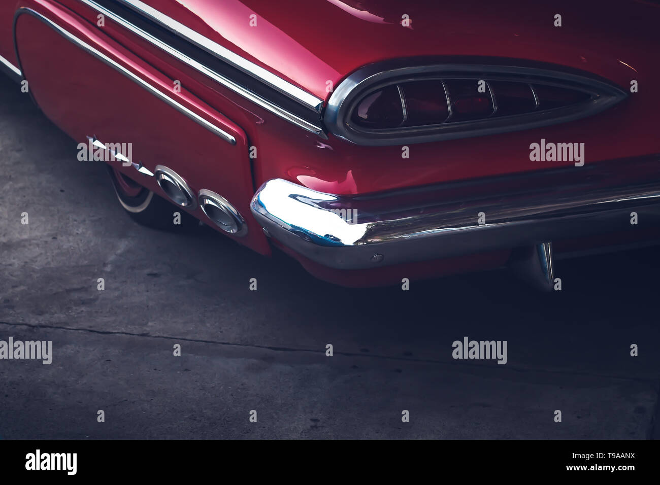 Rear view of a vintage car fin closeup. Red sport car background Stock ...