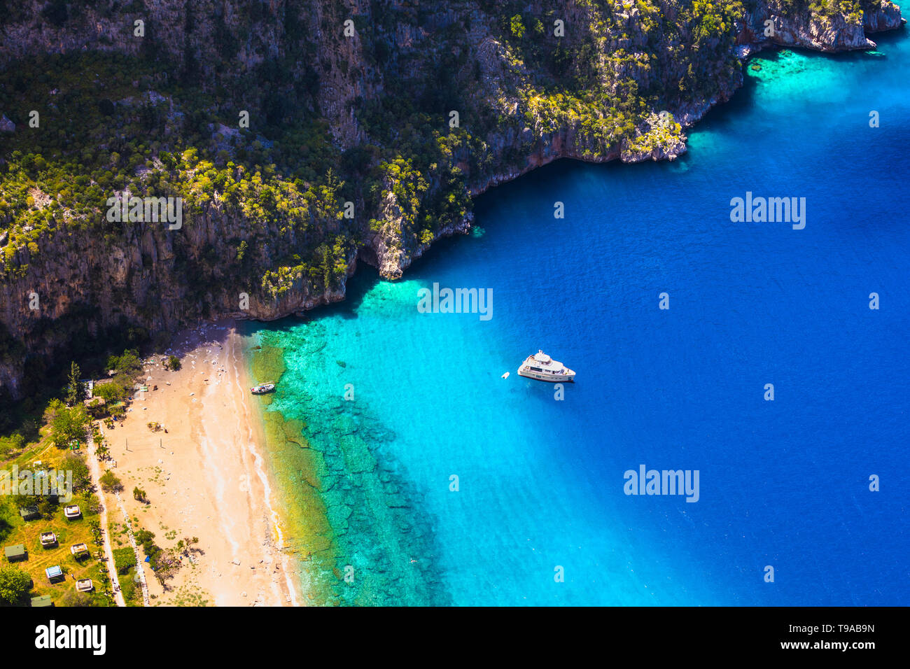 Small sea bay with green forest and deep blue water Stock Photo - Alamy