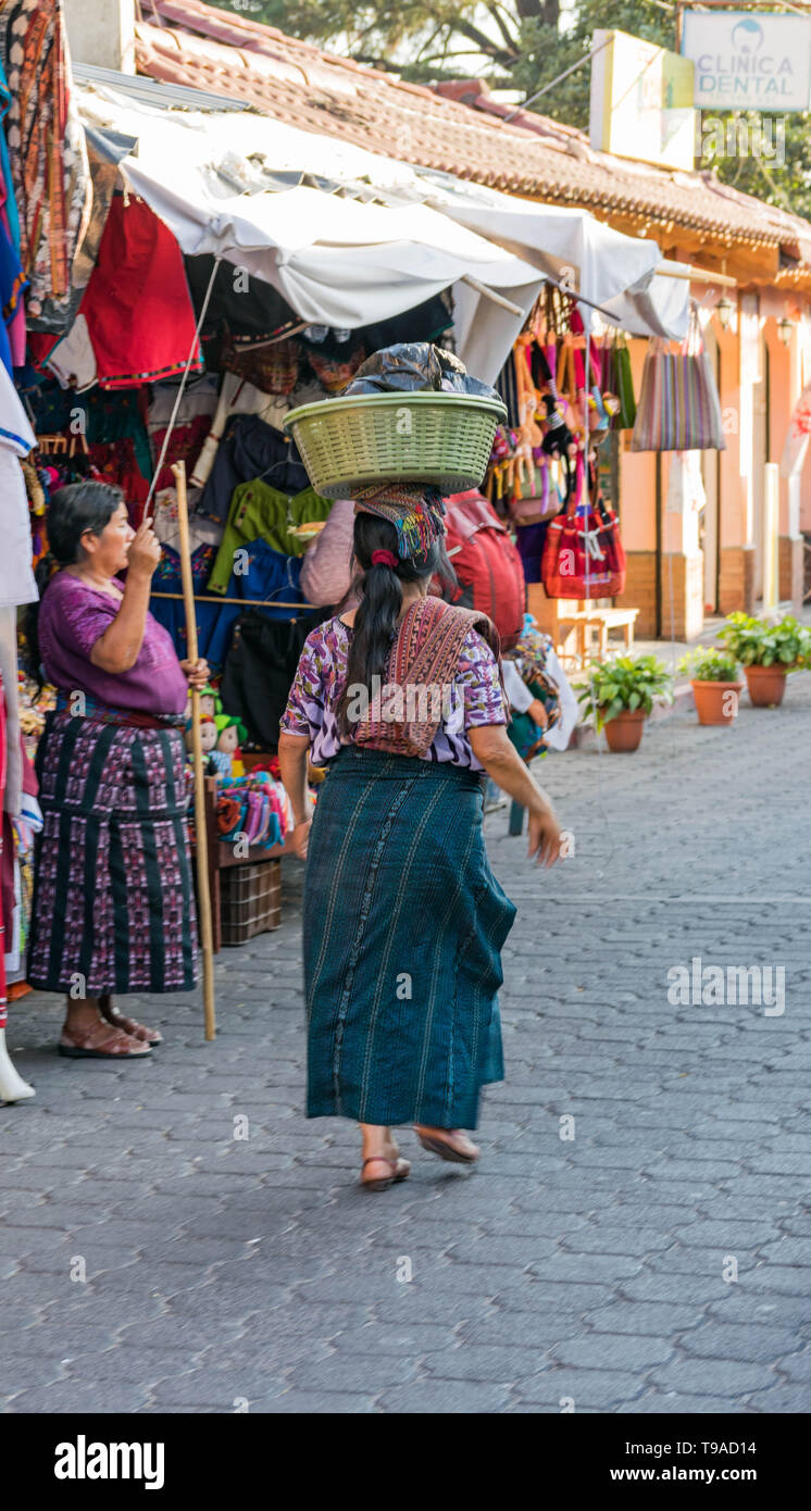 Old woman carrying a basket on her head hi-res stock photography and ...