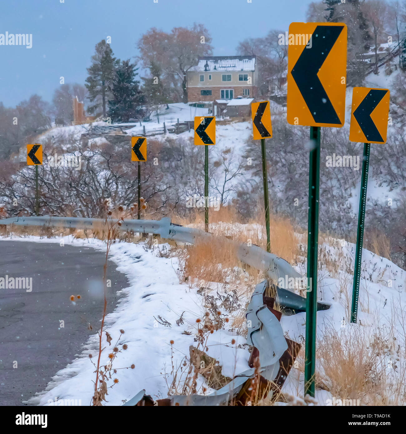 Square Snowy road with directional road signs in winter Stock Photo - Alamy