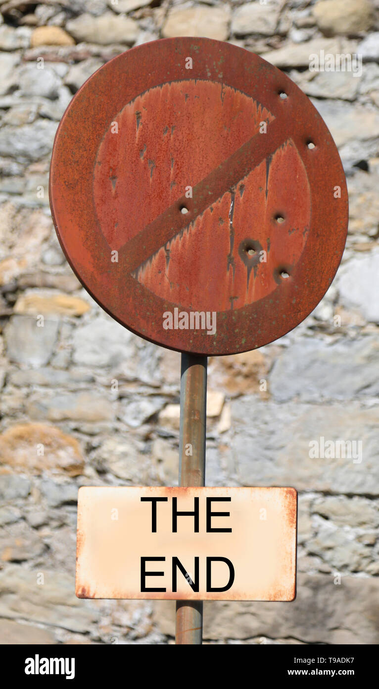 red rusty road sign with the inscription the end Stock Photo - Alamy