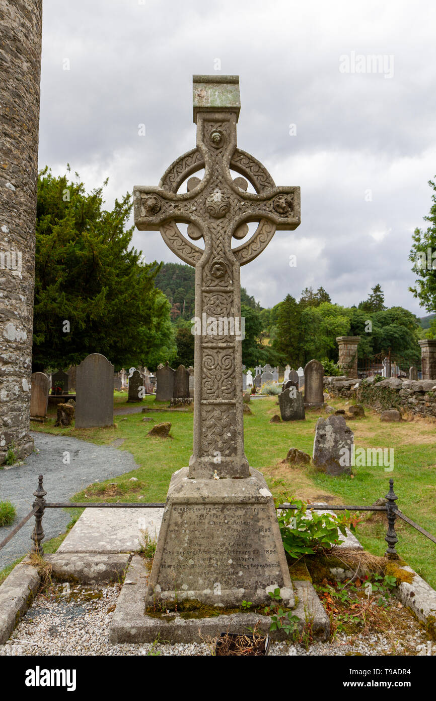 Celtic cross in the Glendalough Cathedral graveyard, Glendalough ...