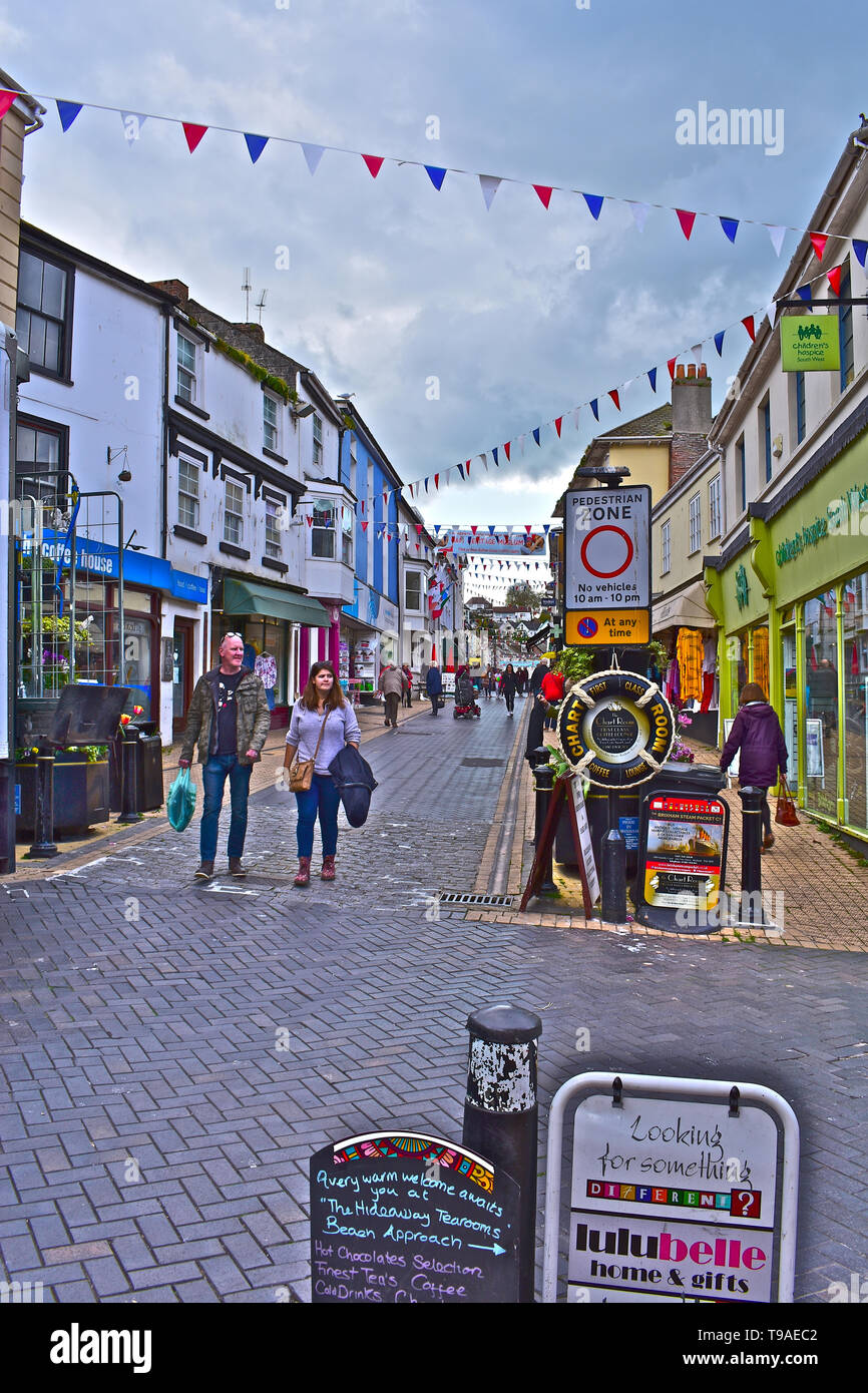 A street view of Fore Street in Brixham, bedecked with bunting in ...