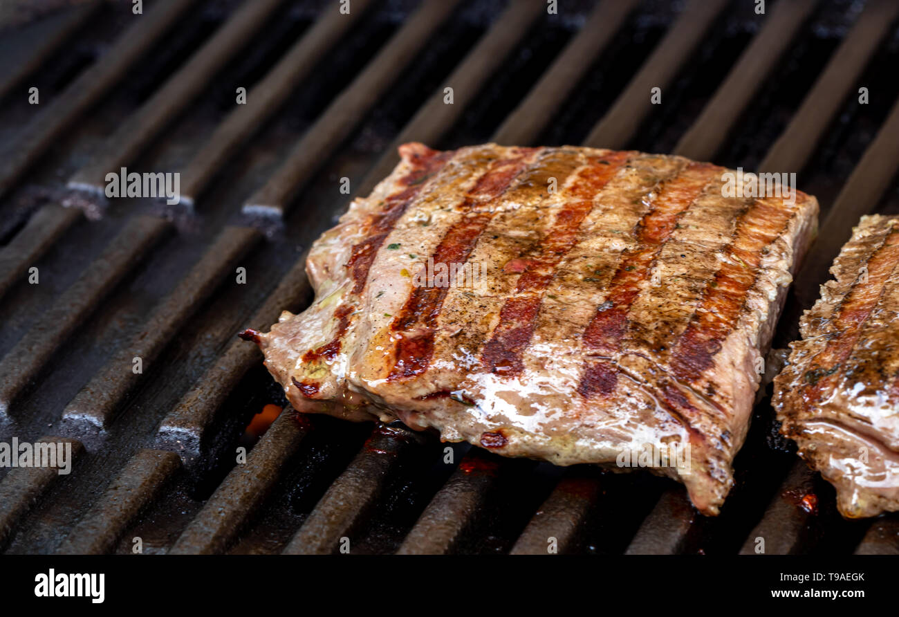 lamb meat on the grill, background with copy space Stock Photo - Alamy