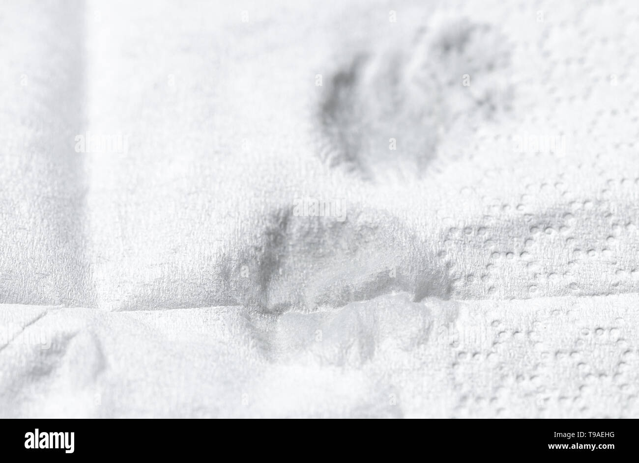 tears on white paper handkerchief close up detail, grief crying sorrow ...