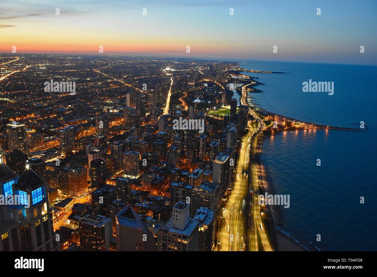 Chicago at sunset as seen from above at 360 Chicago atop the John ...