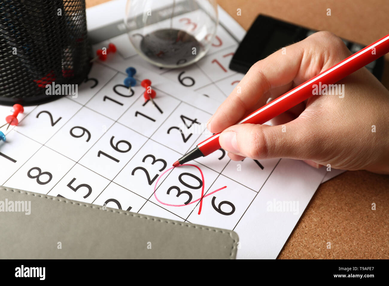 Woman marking date in calendar, closeup. Deadline concept Stock Photo ...