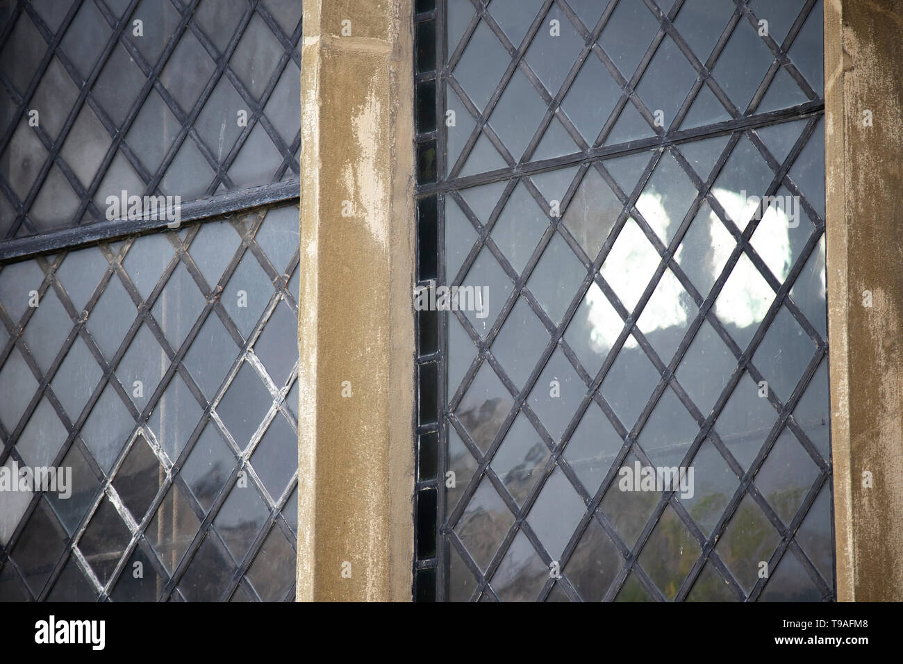 Leaded windows with stonework frames to historic ecclesiastical ...
