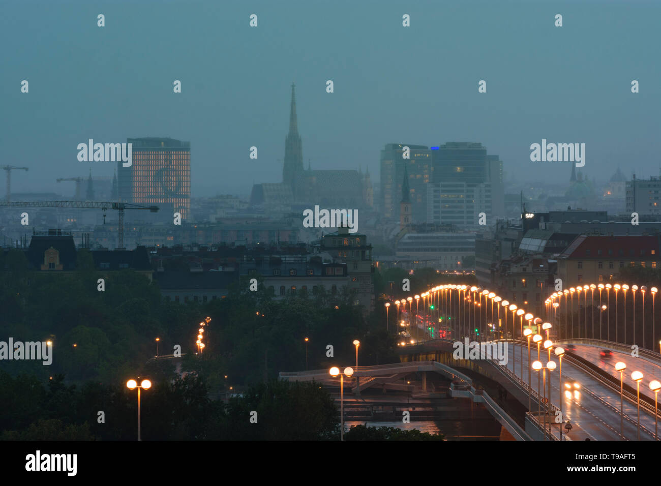Wien, Vienna: rain rainy, bridge Reichsbrücke, city center, cathedral ...