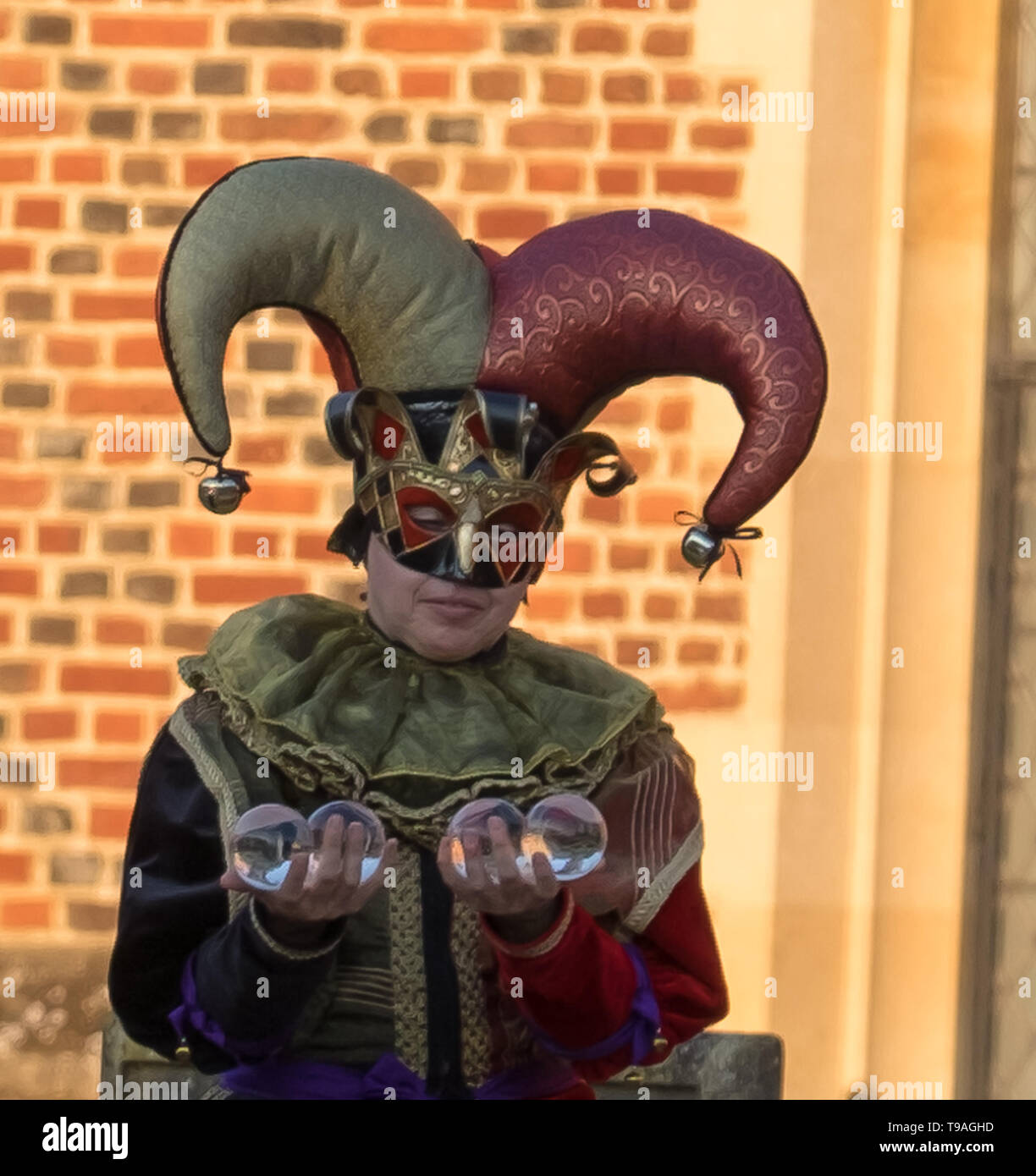 jester juggling glass balls Stock Photo - Alamy