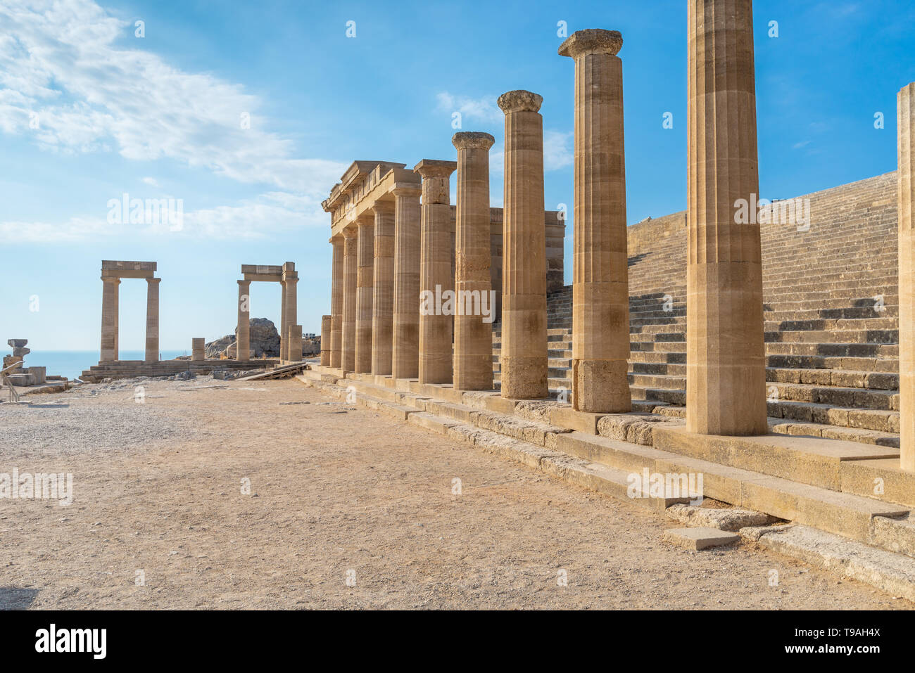 Antique columns and stairway of a beautiful acropolis of Lindos, Greece ...