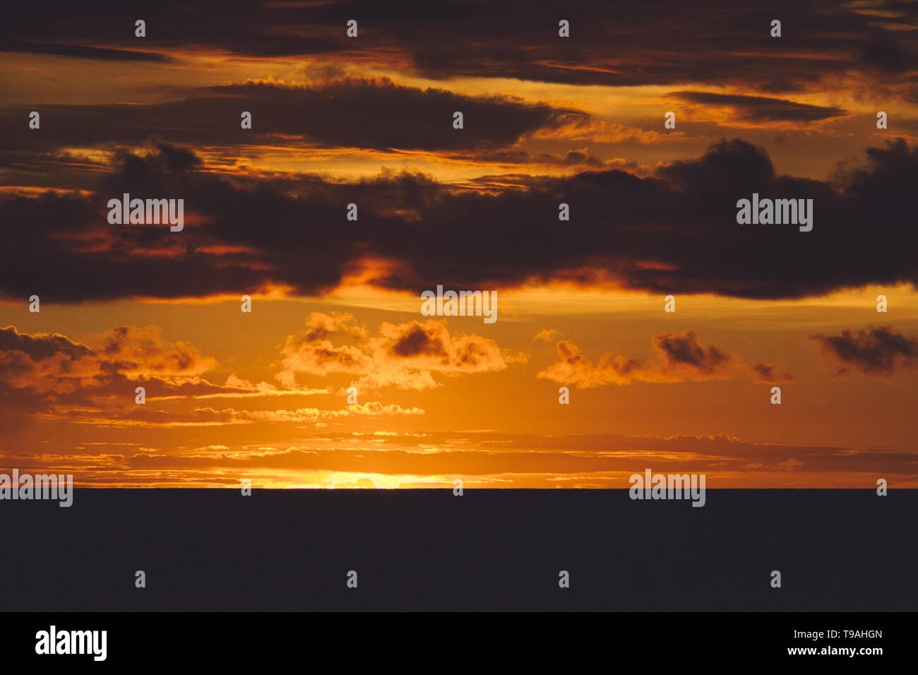 Orange sunset in Thailand Stock Photo - Alamy