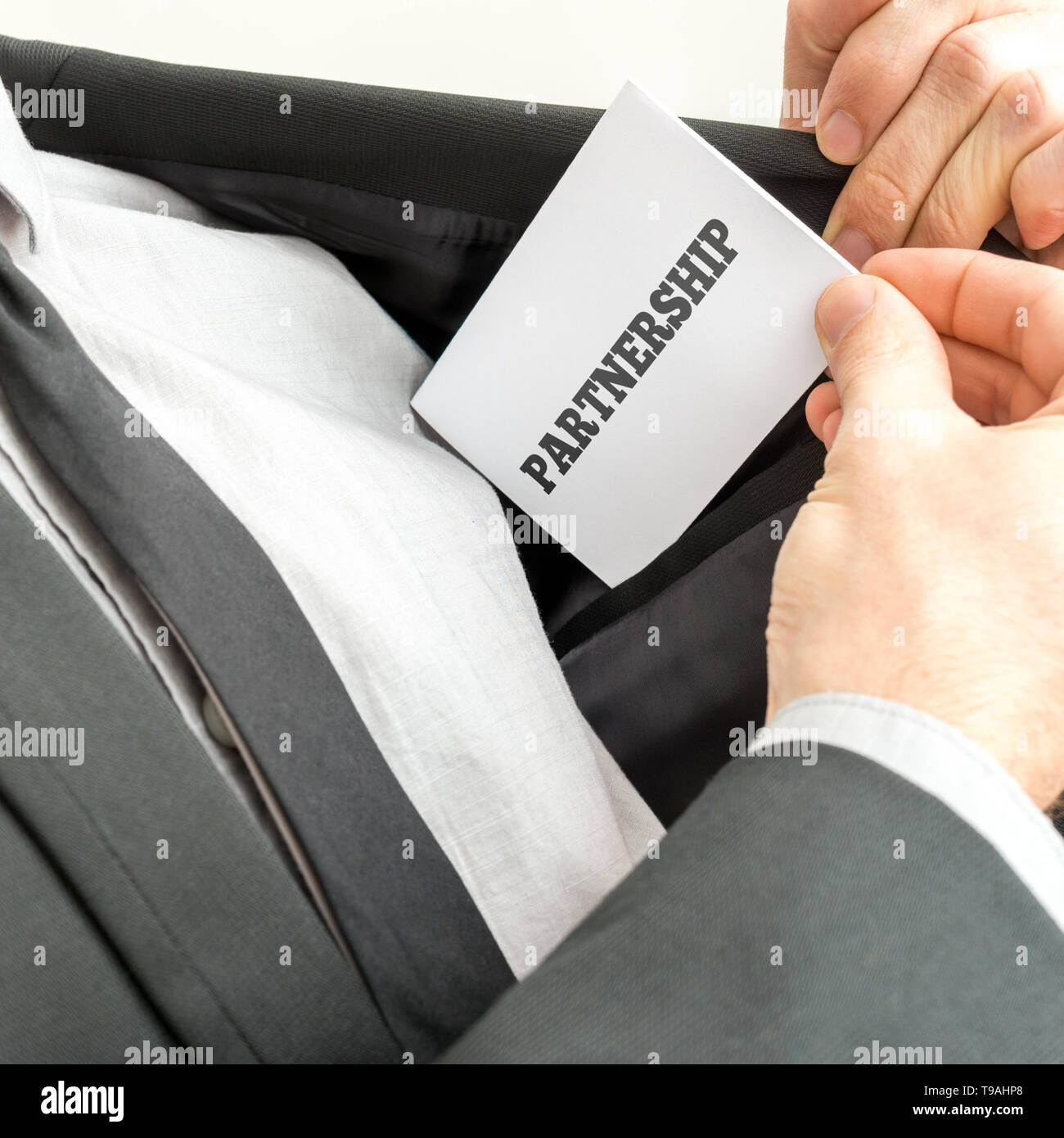 The word business and businessman holding his jacket against green ...