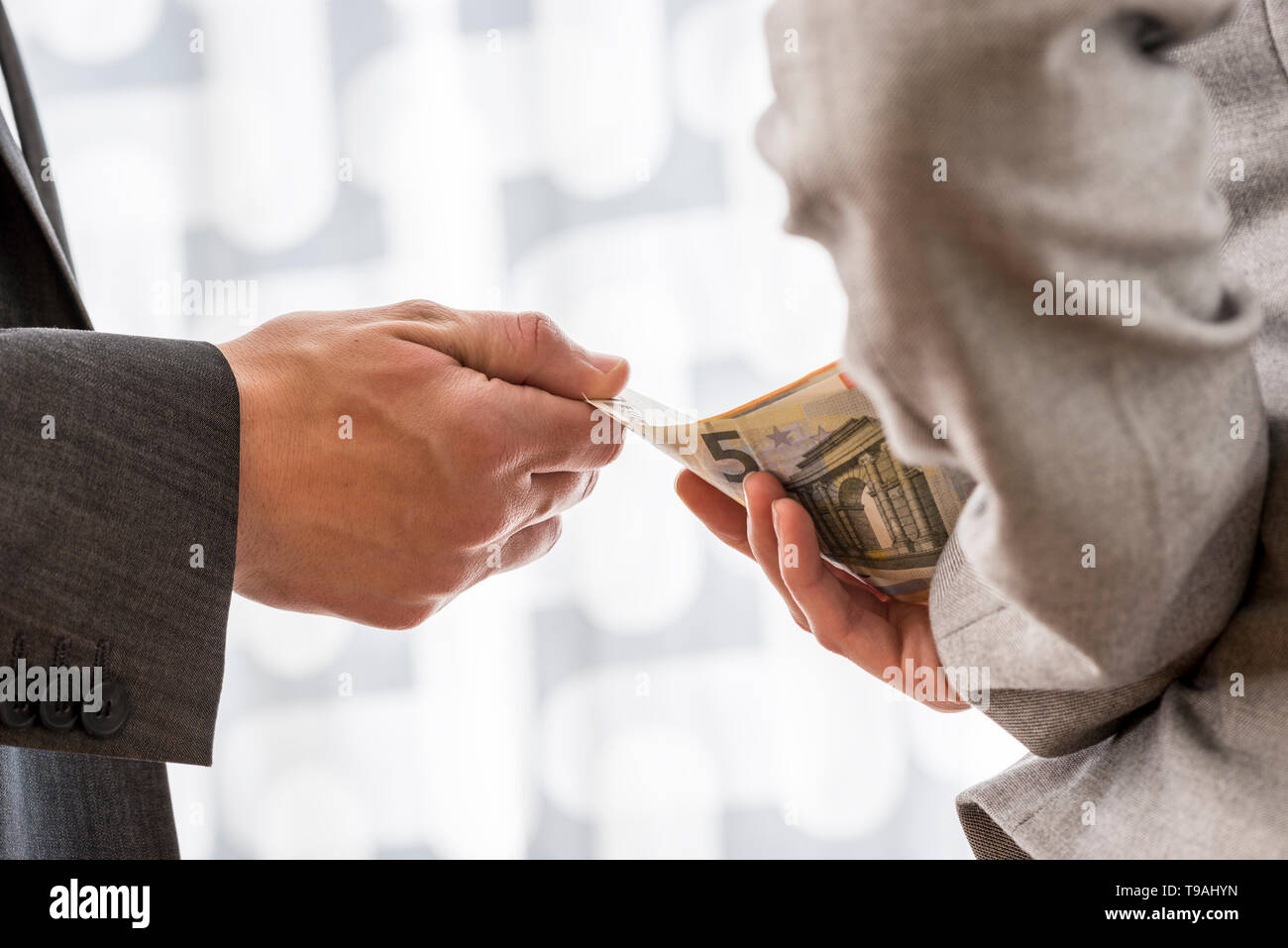 Man handing cash to woman hi-res stock photography and images - Alamy