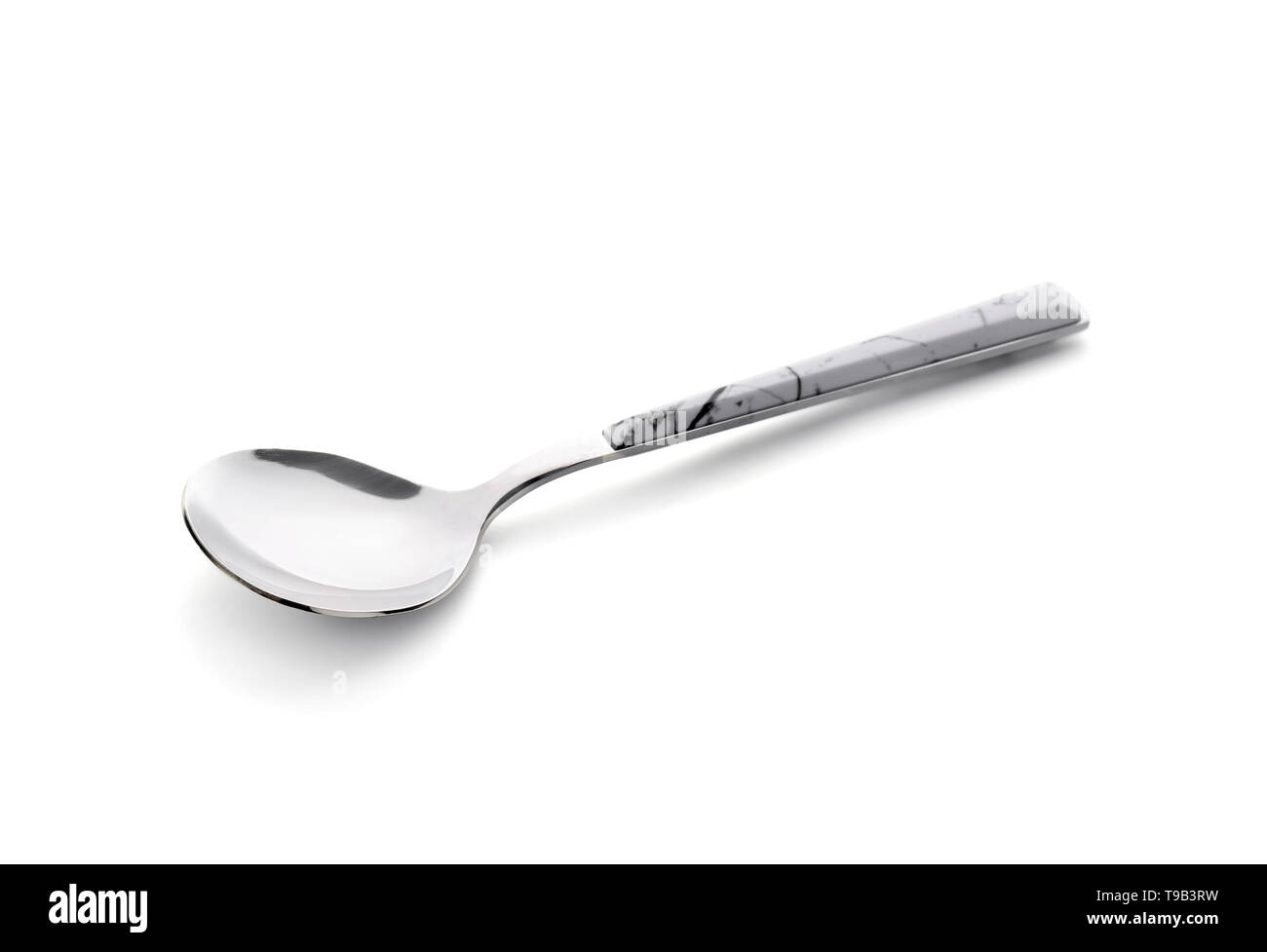Metal spoon on white background Stock Photo - Alamy